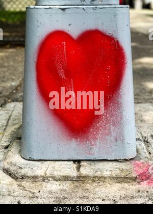 Red heart painted on light background Stock Photo - Alamy