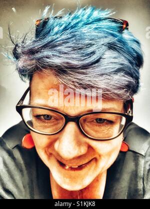 50-year old woman with dyed blue hair Stock Photo: 156106237 - Alamy