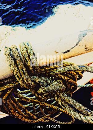 Ropes tied to ships rail at sea Stock Photo - Alamy