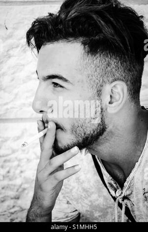 Portrait of a man smoking a cigarette. Palestinian Refugee Camps of ...