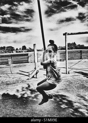 Girl riding on zip wire on Trollandia Highwire Park aerial ropeway and ...