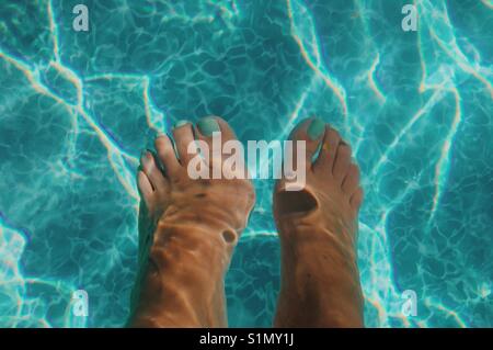 Feet under water Stock Photo - Alamy