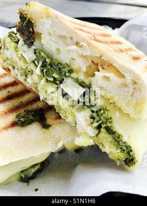 Cut in half panini sandwich on serving board Stock Photo - Alamy