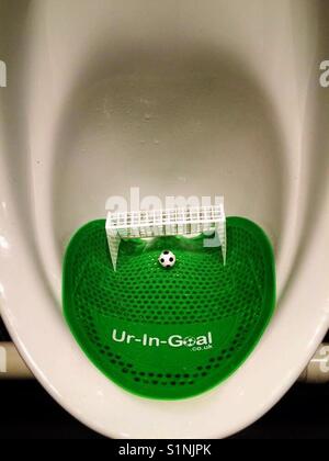 football goal with ball in a urinal Stock Photo - Alamy