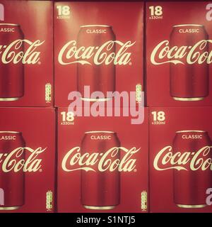 Cans of Coca Cola on display on a supermarket shelf Stock Photo - Alamy