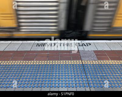 mind the gap between platform and train at london underground station ...