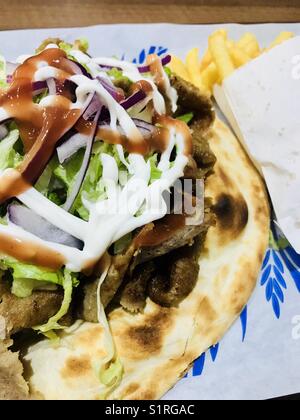 doner kebab with french fries and salad Stock Photo - Alamy