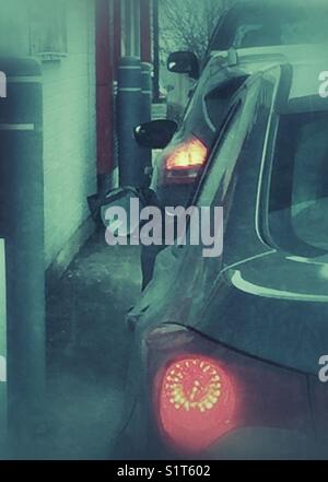 Cars waiting in a drive thru of a McDonald's fast food restaurant in ...