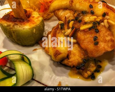 Fillet of scabbard fish with passion fruit and banana, plus onion and ...