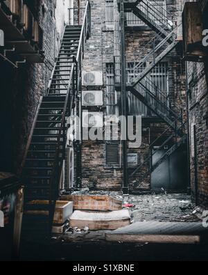In the back alley with an old fire escape Stock Photo - Alamy