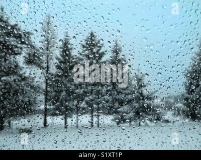 Rain drops are seen on the window of a Boeing 737 airliner in Athens ...