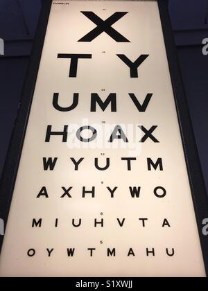 Eye test board on a wall Stock Photo - Alamy