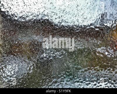 Freezing rain on the window of a house. Freezing rain is precipitation ...
