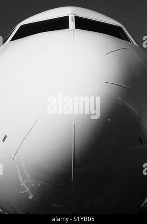 View of the nose and cockpit black windshield of the aircraft and the ...
