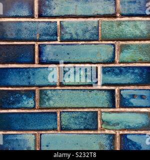 Bright blue tiles on wall above bath in modern Spanish bathroom Stock ...