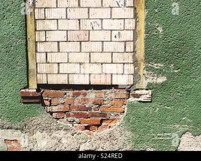 Wall with bricked up window Stock Photo - Alamy