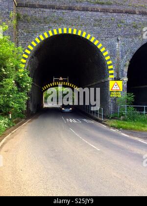 Low Bridge with chevrons and height limit, Solihull, UK Stock Photo - Alamy