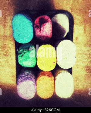 Wooden box of coloured chalk in front of blackboard Stock Photo - Alamy