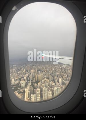 Amazing view from the airplane window during the sunset over mountains ...