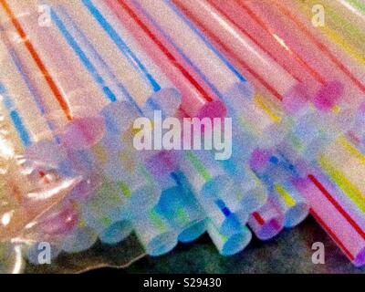 Colored striped bright plastic straws in a jar Stock Photo - Alamy