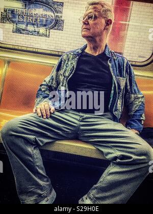Manspreading Man in New York City subway hogging seats, USA Stock Photo ...