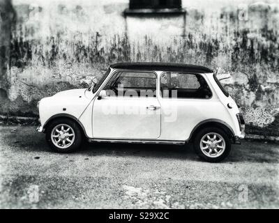 Side view of a parked Old Classic antique black and off white cream ...