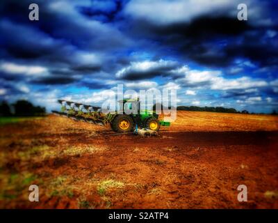 John Deere tractor and plough, Bawdsey, Suffolk, England Stock Photo ...