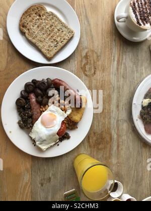Scottish breakfast of Haggis, sausage, baked beans, mushrooms at a ...