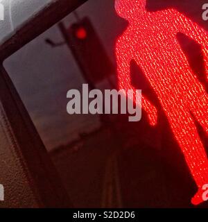 Red man symbol at a pedestrian crossing indicating it is not safe to ...