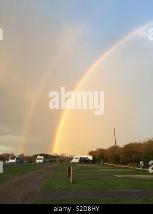 Sun and rainbow Stock Photo - Alamy