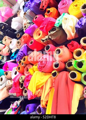 Colorful Rolls of Fabric in Store Display for Selling Stock Photo - Alamy