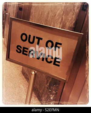 Sign in front of broken elevator door: "caution – do not enter Stock ...