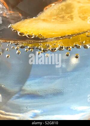 Lemon slice in sparkling water Stock Photo - Alamy