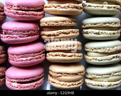French colorful macarons in a rows Stock Photo - Alamy