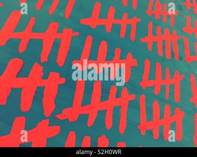 Red tally marks on a green background Stock Photo - Alamy