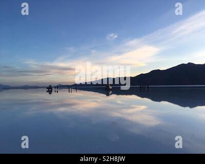The world's largest mirror, sunset on the salt flats of the Salar de ...