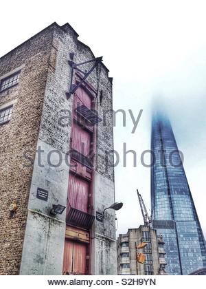 Exterior of old brick warehouse with loading dock Stock Photo ...