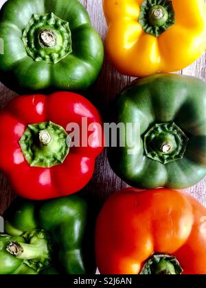 Frame of whole green bell peppers on white background Stock Photo - Alamy