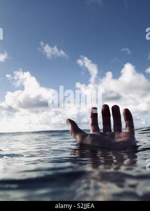 A hand floating in water. Hanalei Bay, Kauai, USA Stock Photo - Alamy