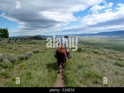 lone rider on horseback at mountains Stock Photo - Alamy