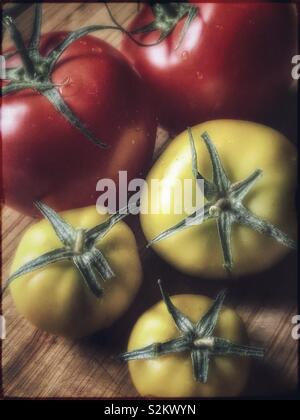 Fresh tomatoes on rustic wooden background. Tomatoes on wooden table ...