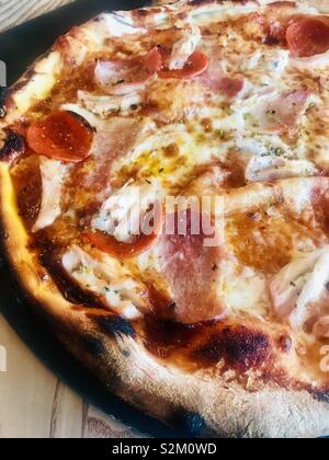 Meat feast pizza with ham, bacon, beef Stock Photo - Alamy