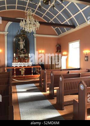 Small church interior with pews and pulpit, empty chapel with an arched ...