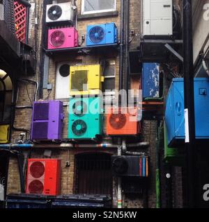 Colourful air conditioning units on the rear of a building in London ...