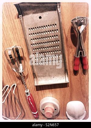 Vintage kitchen utensils mounted on a display board, United States ...