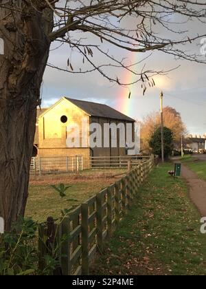 Rainbow over the Barn Stock Photo - Alamy