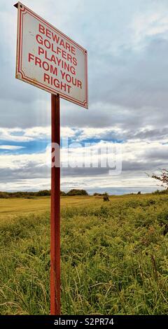 WARNING SIGN ON A GOLF COURSE YOU MAY BE INJURED BY A BALL Stock Photo ...