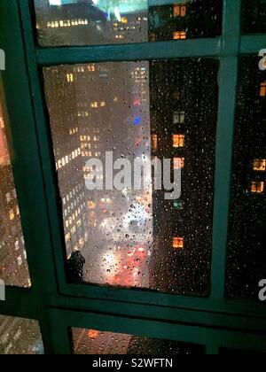 Looking out a apartment casement window in midtown Manhattan during a ...