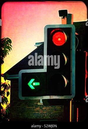 Traffic light with green arrow left and right turn signal against blue ...