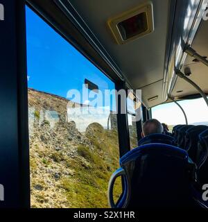 View through bus window of buses in bus station in the town centre ...